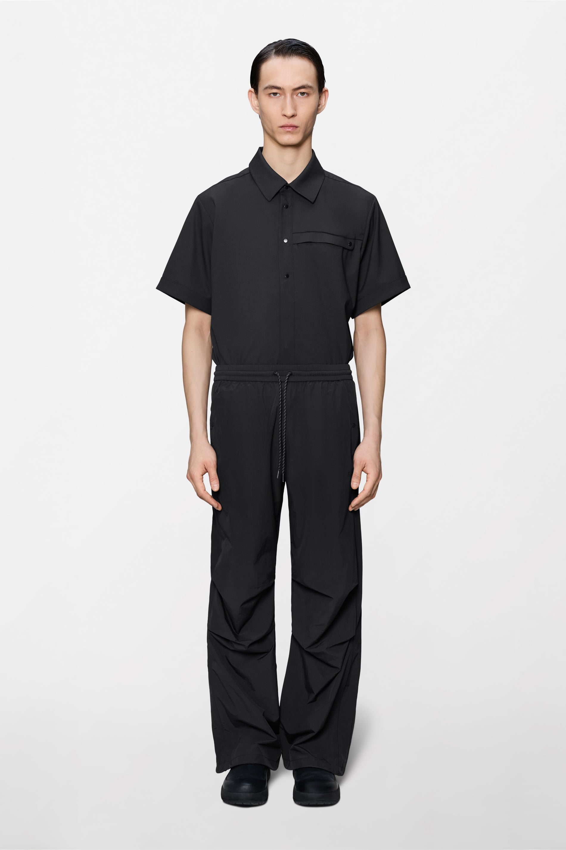 Rains® Cooldown Track Pants in Black for £149 | Free Shipping