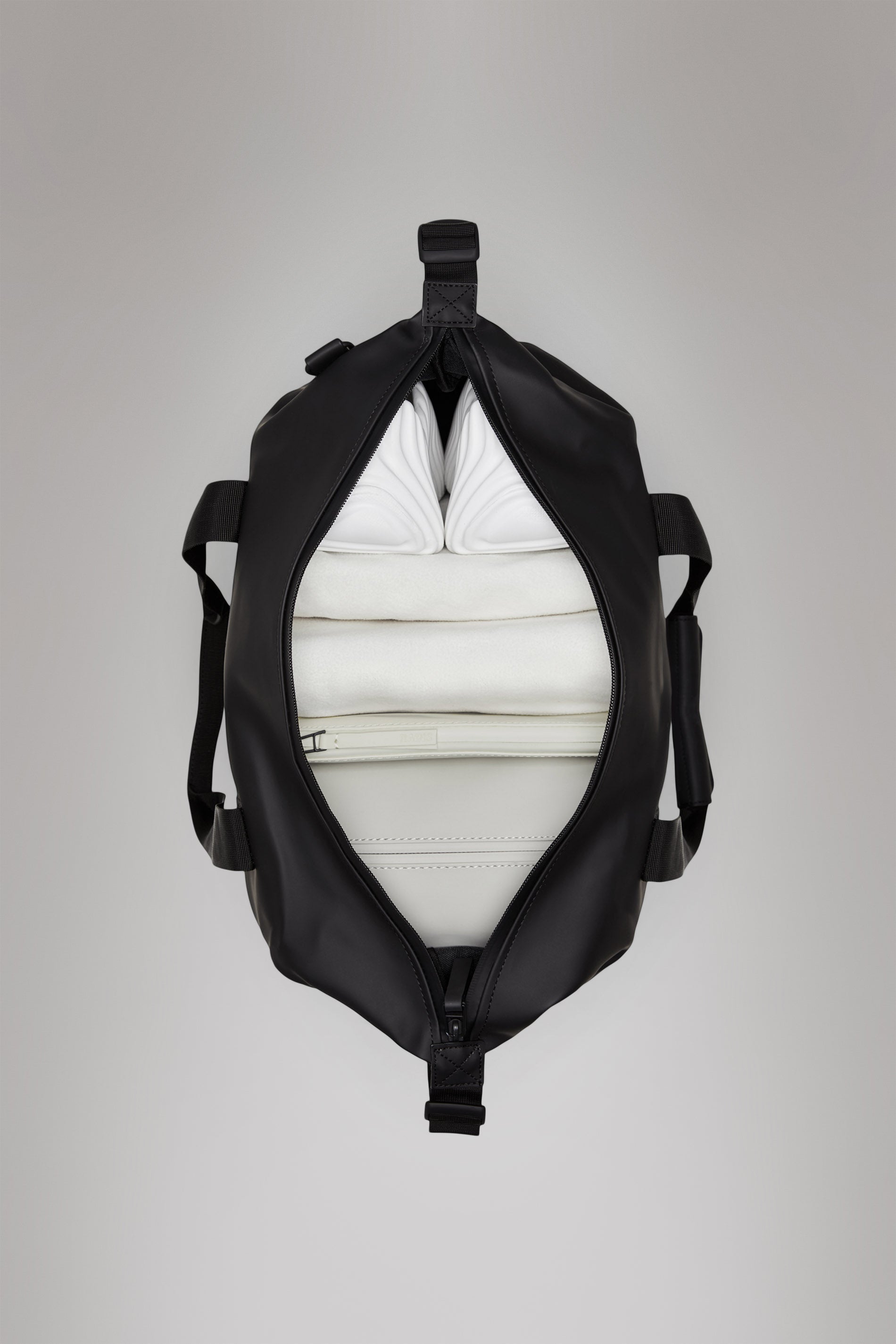 Rains® Hilo Weekend Bag Small in Black for £69 | No Custom Duty