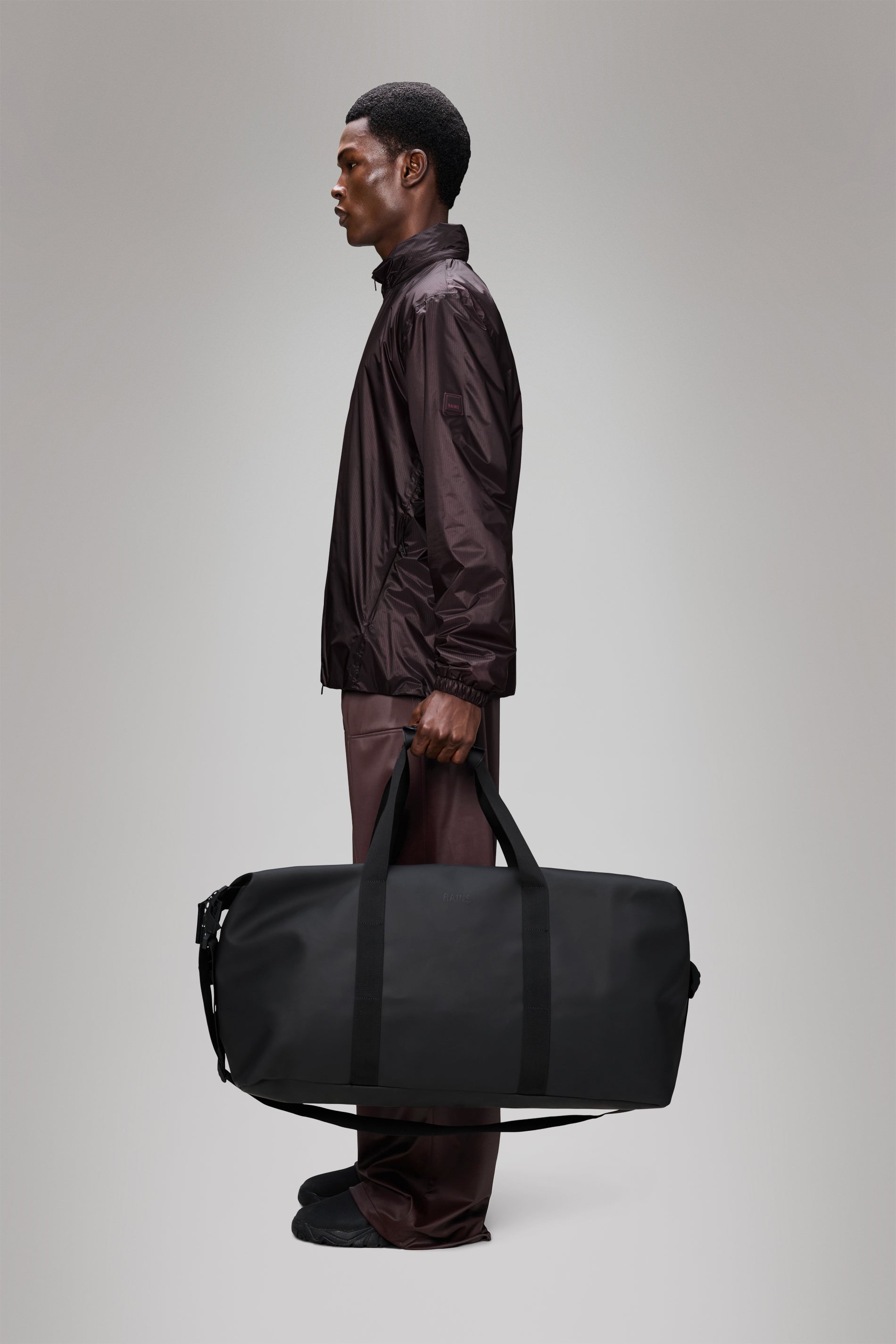 Rains® Hilo Weekend Bag Small in Black for £69 | No Custom Duty