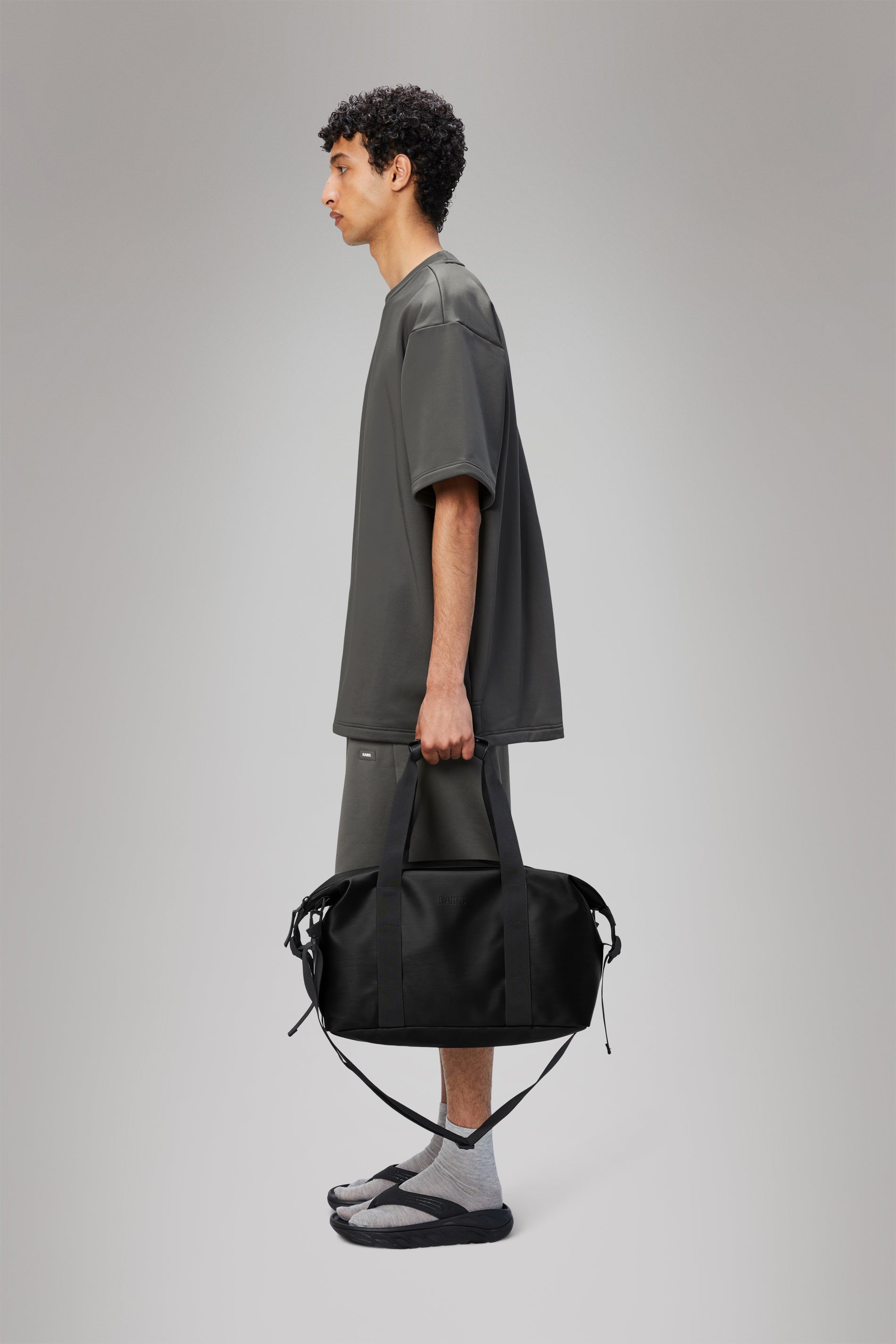 Rains® Hilo Weekend Bag in Black for £79 | No Custom Duty